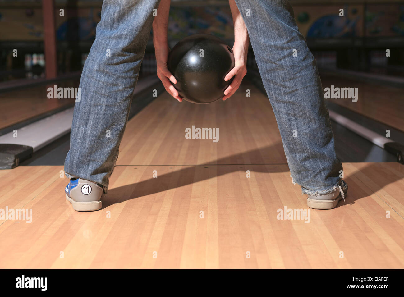 A bowling player in the alley Stock Photo - Alamy