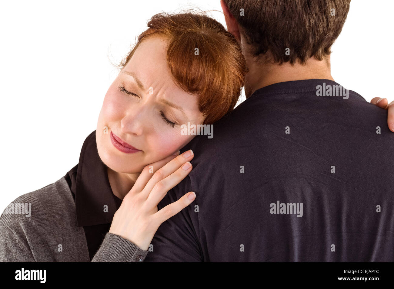 Scared woman holding onto man Stock Photo - Alamy