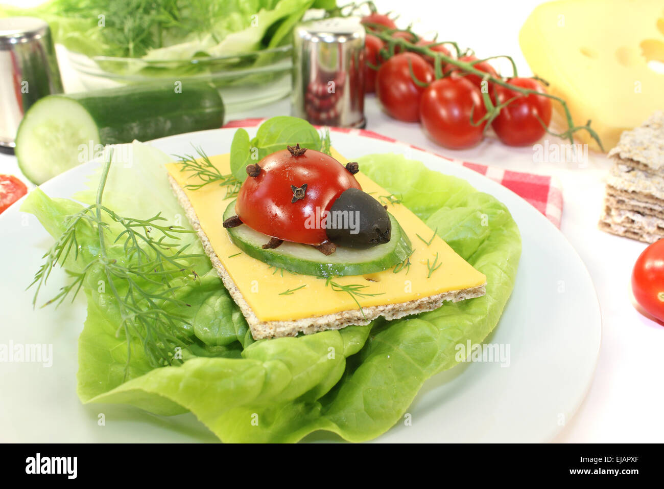 crisp bread with cheese and ladybug Stock Photo - Alamy