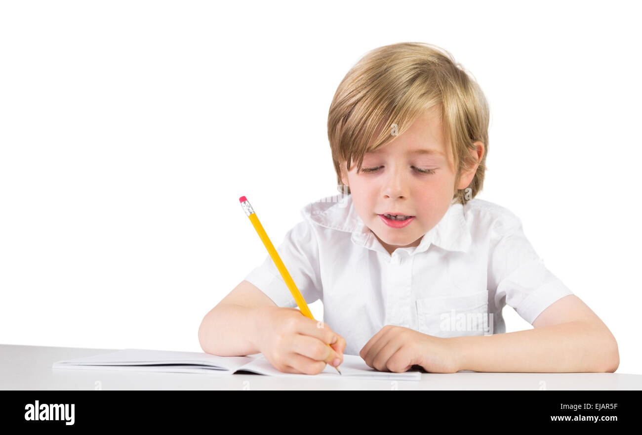 Happy child writing down homework Stock Photo - Alamy