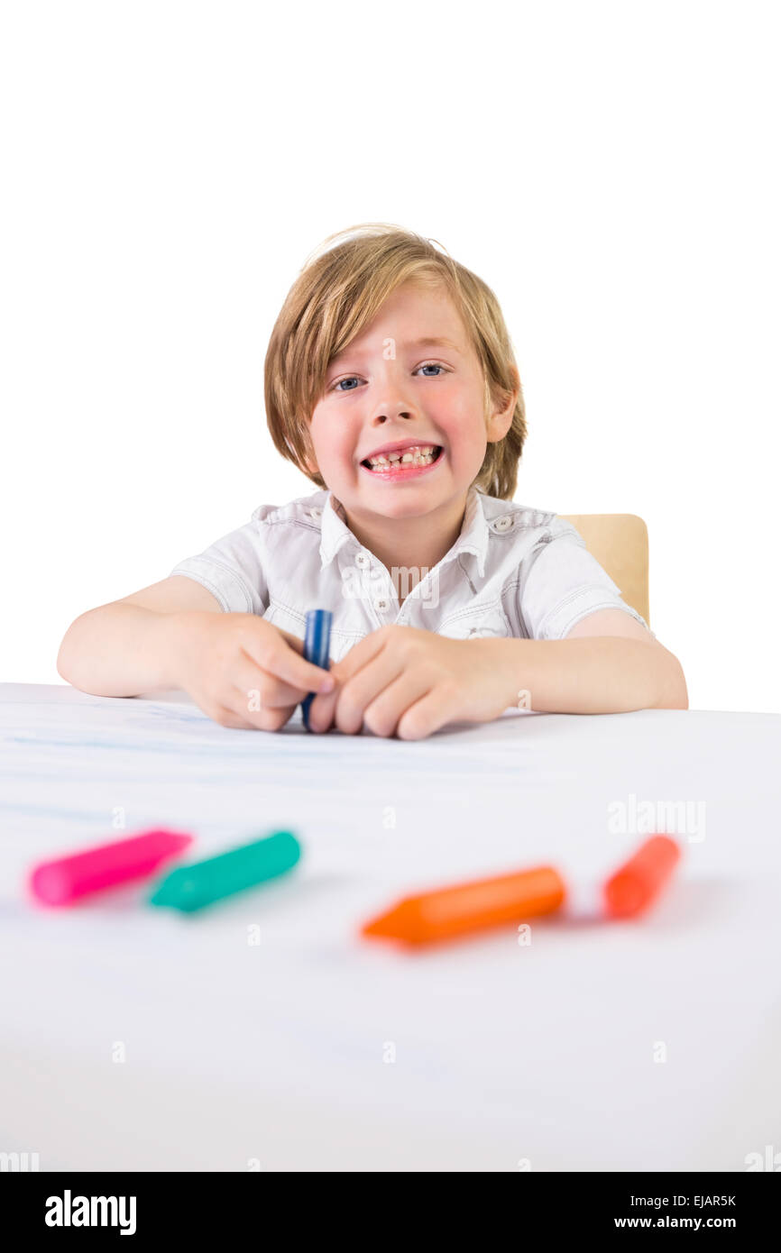 Student using crayons to draw Stock Photo - Alamy