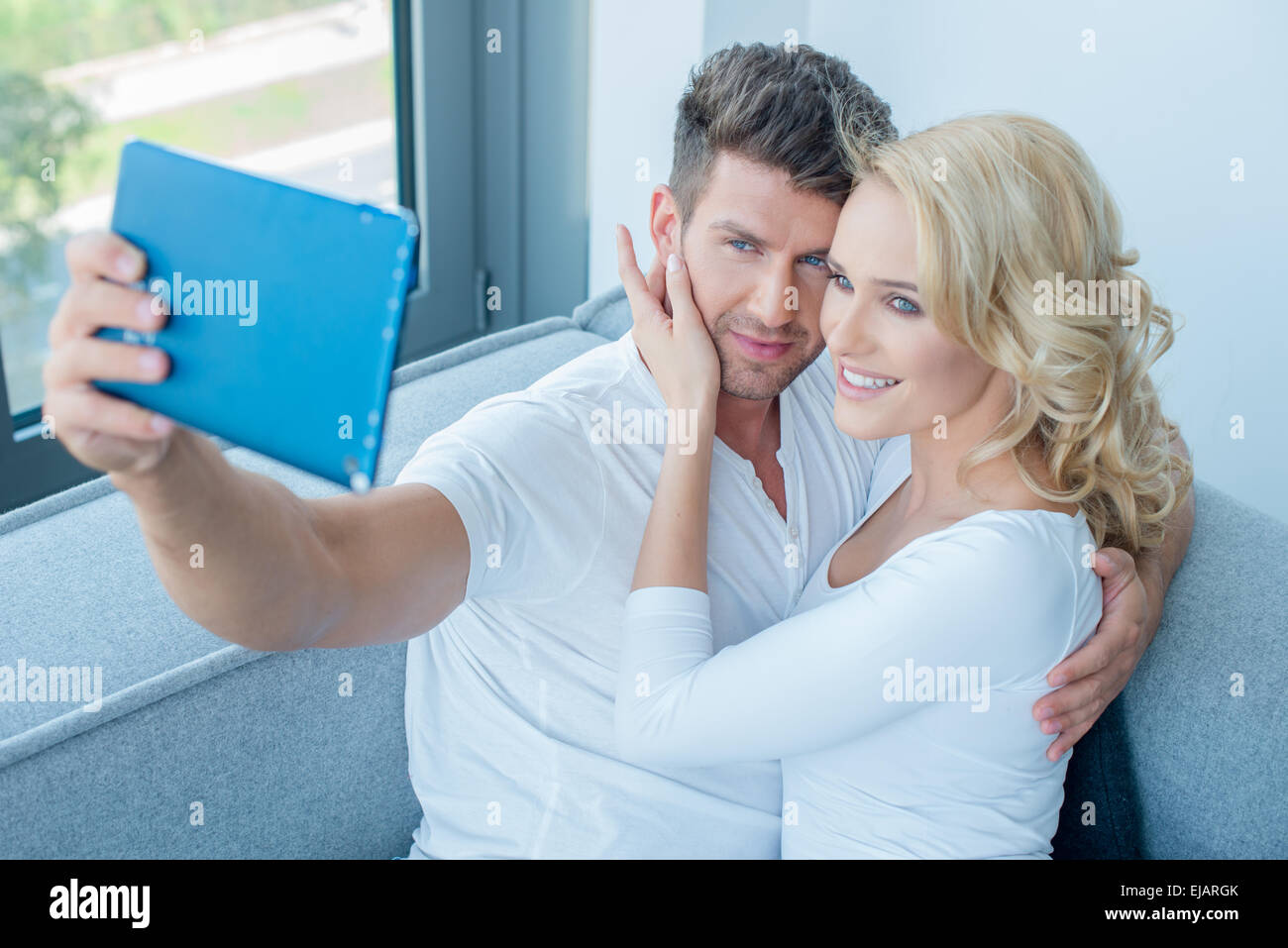 Young White Couple Taking Self Photos Stock Photo - Alamy