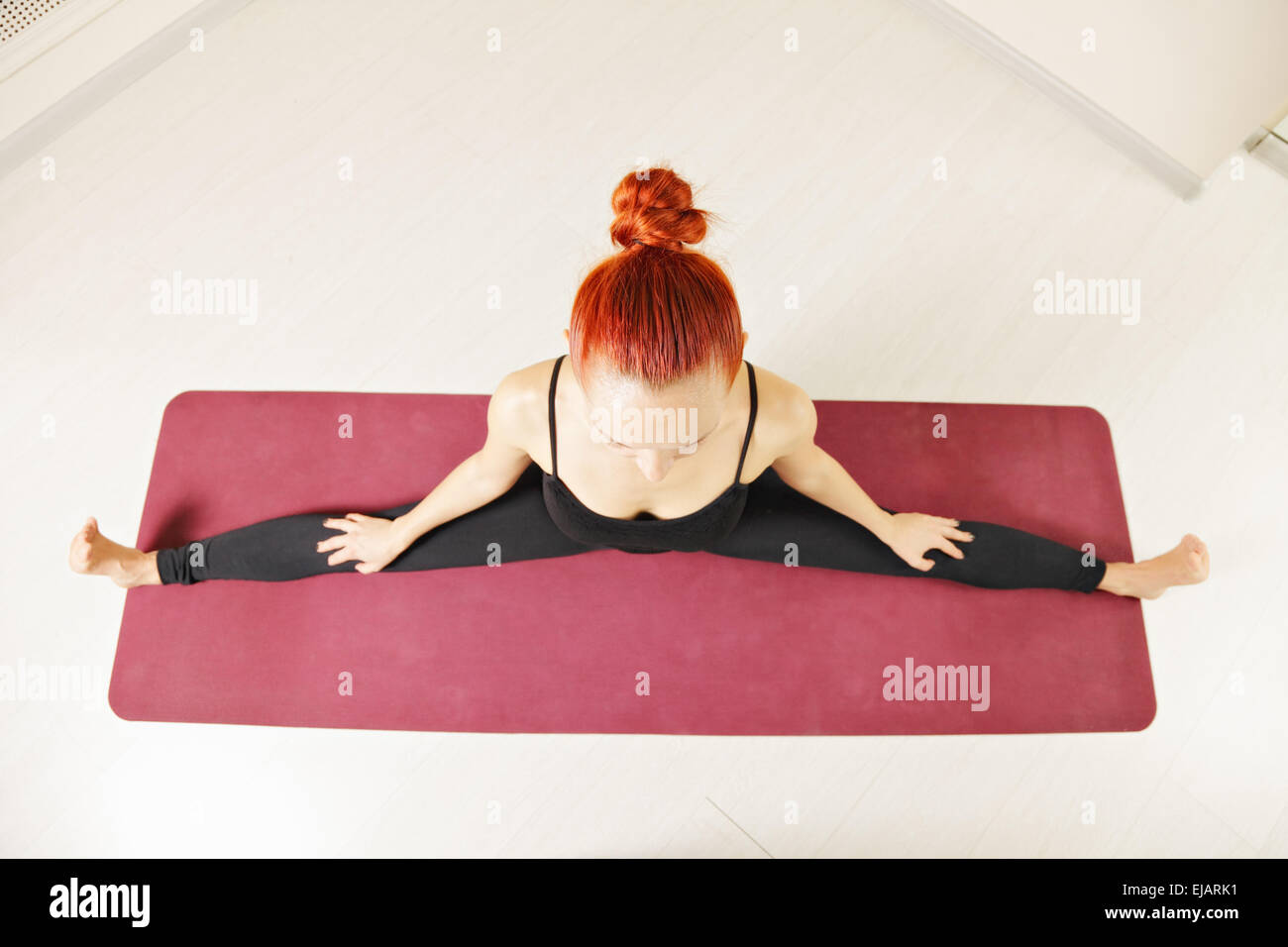Woman stretching legs out Stock Photo - Alamy