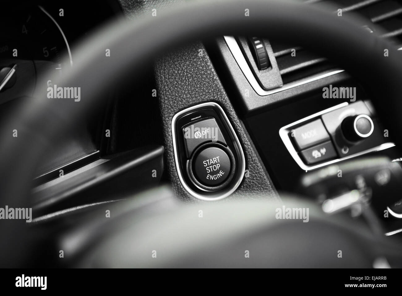 Detail on a black start button in a car Stock Photo - Alamy