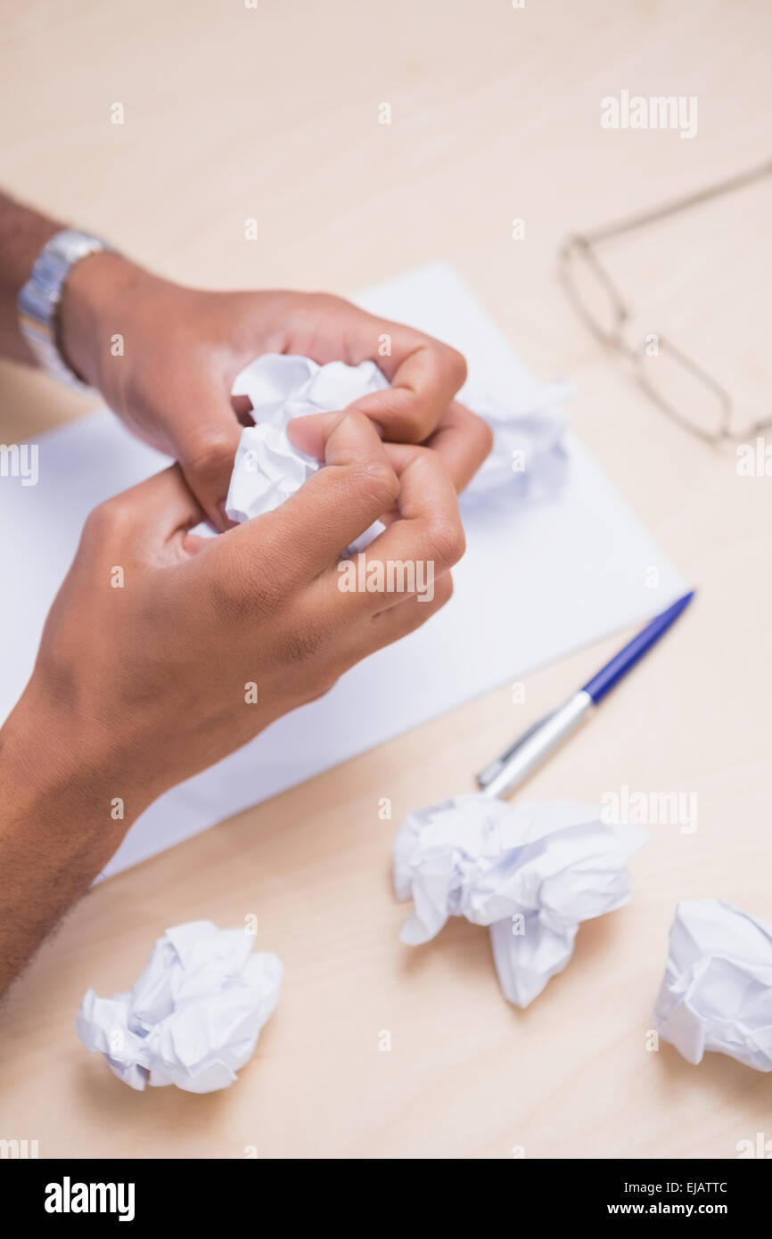 Hands crumpling papers on desk Stock Photo - Alamy