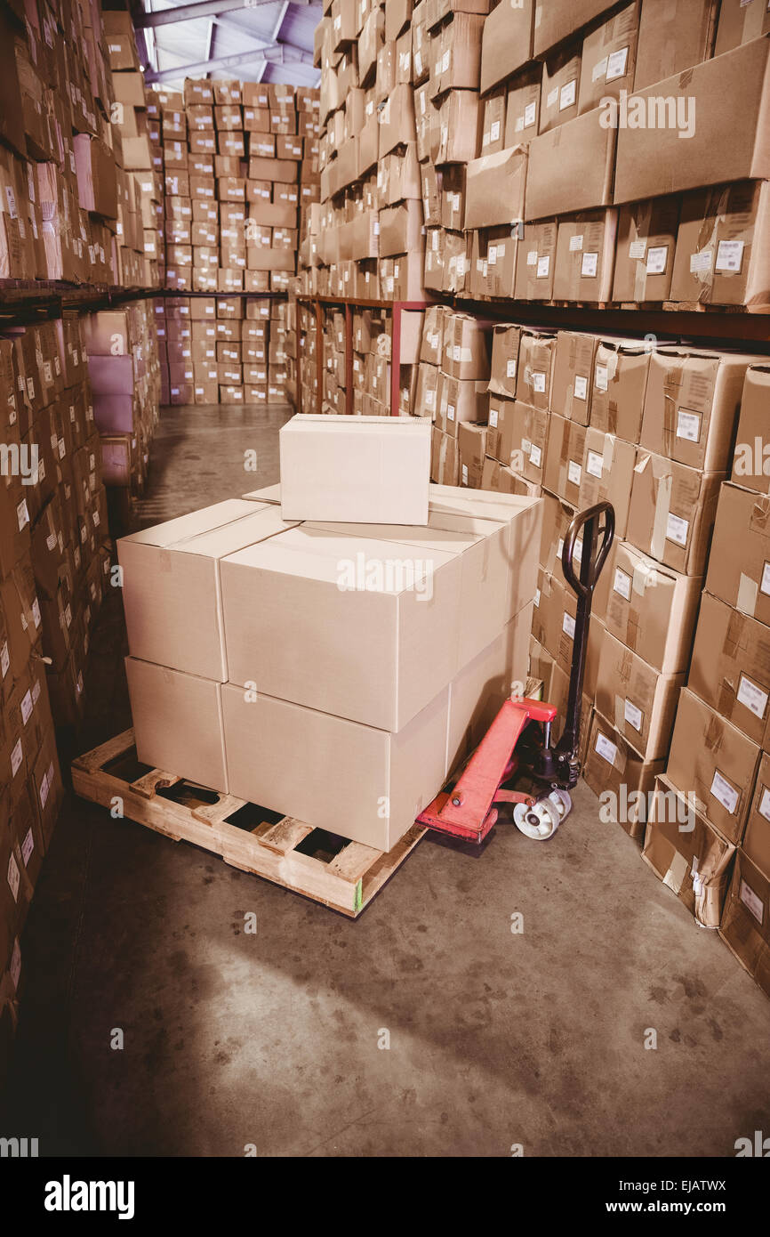 Boxes in warehouse Stock Photo - Alamy