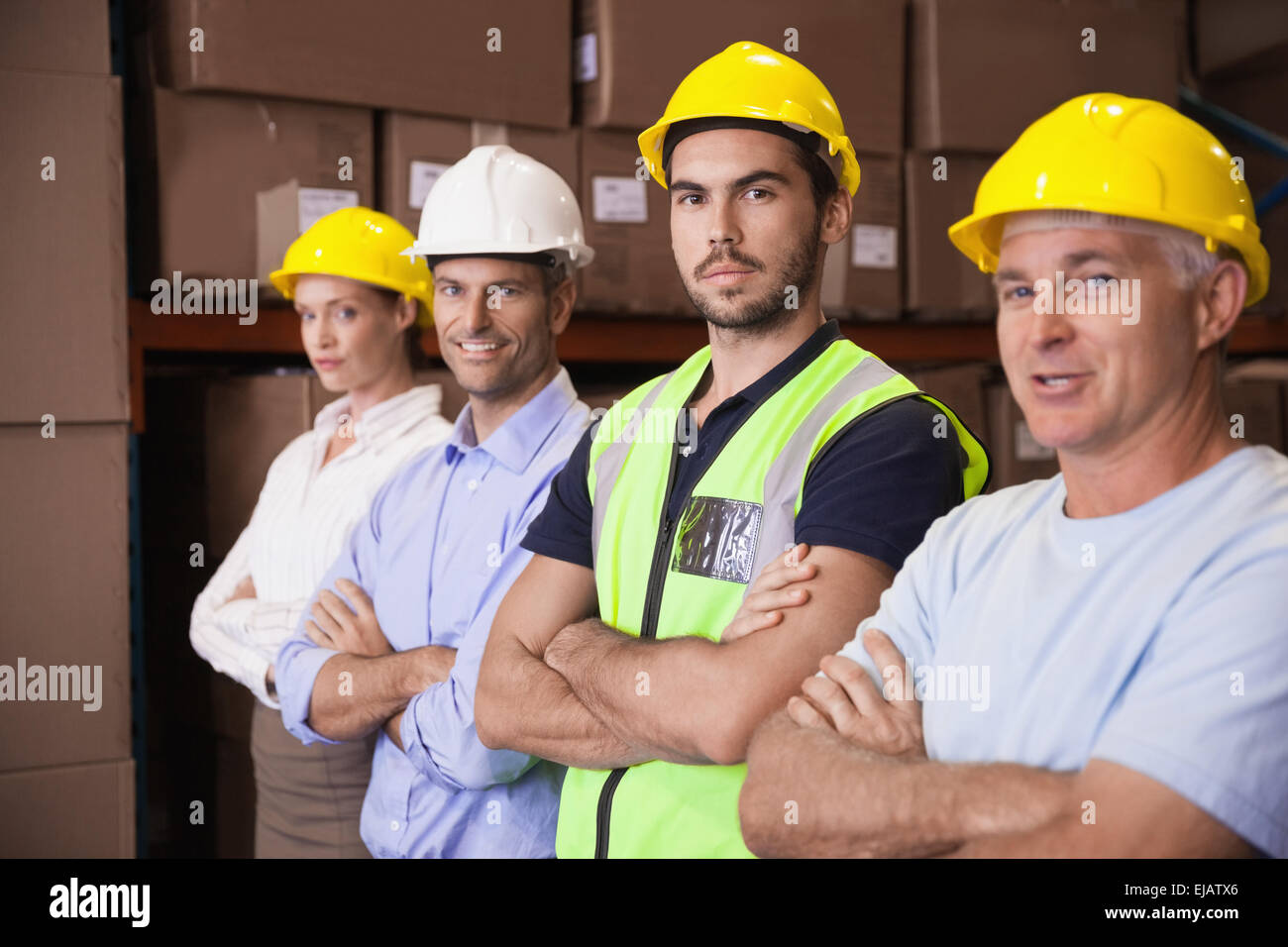 Portrait warehouse team standing arms hi-res stock photography and ...