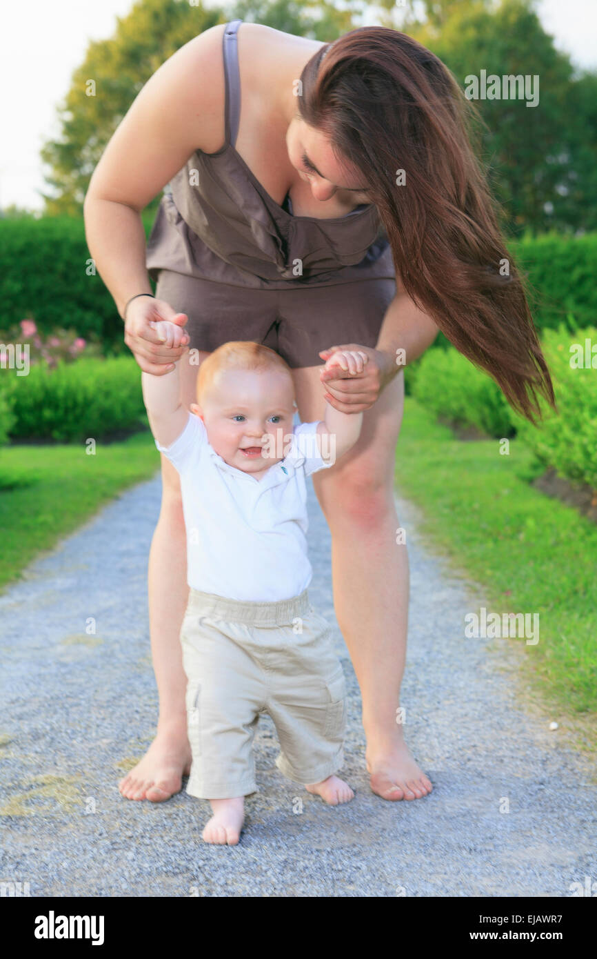 A mother walking baby forest Stock Photo - Alamy