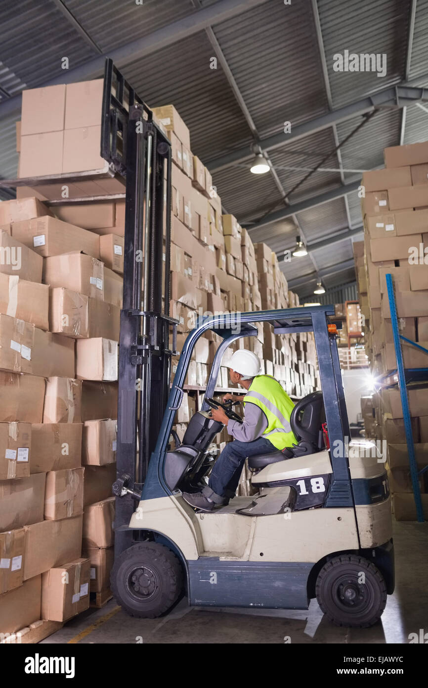 Forklift machine in warehouse Stock Photo - Alamy