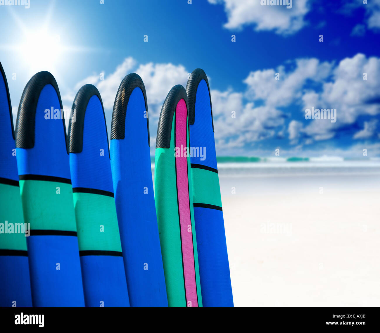 Color surf boards in a stack by ocean Stock Photo - Alamy