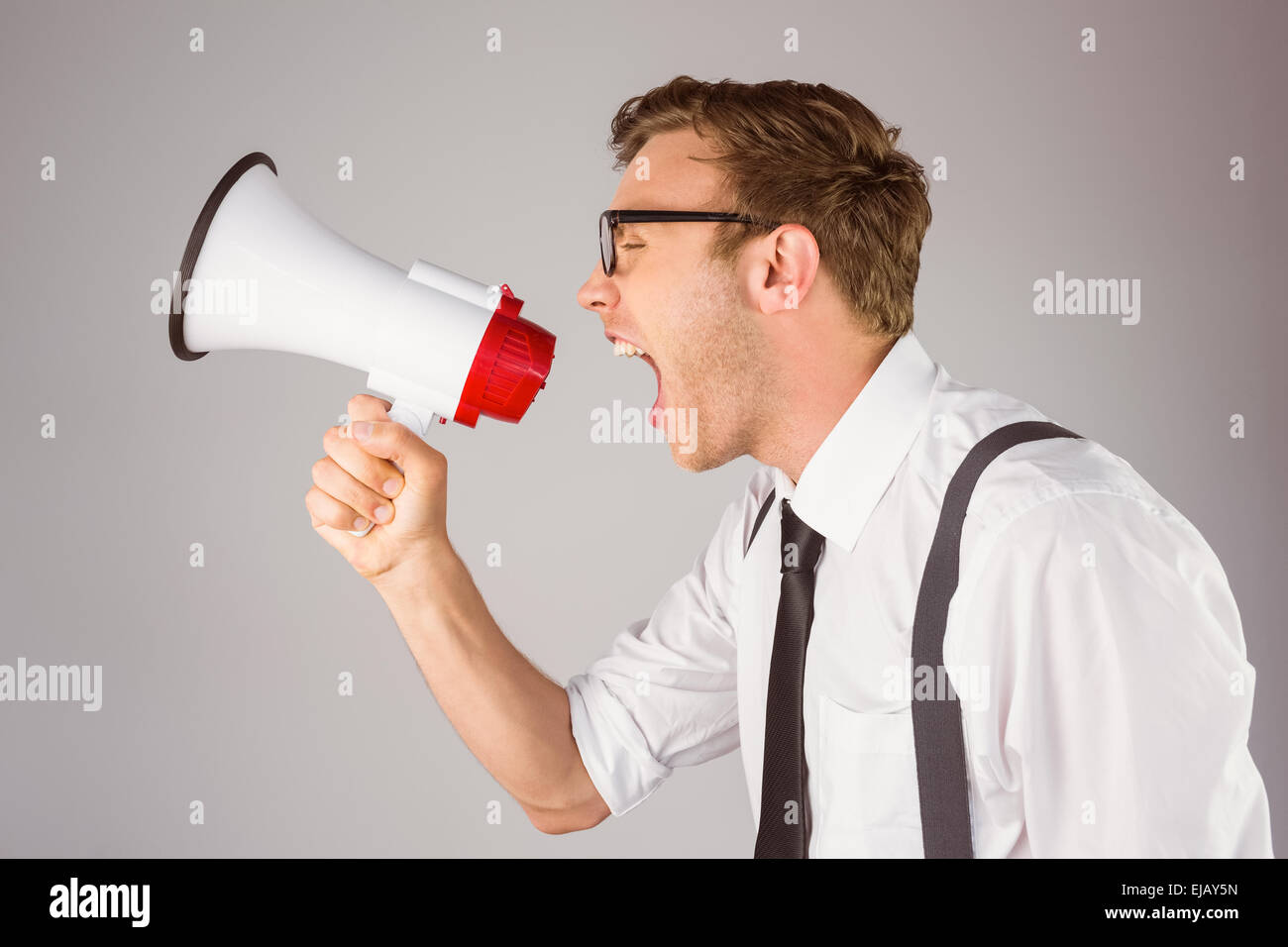 Caucasian businessman yelling through megaphone hi-res stock ...