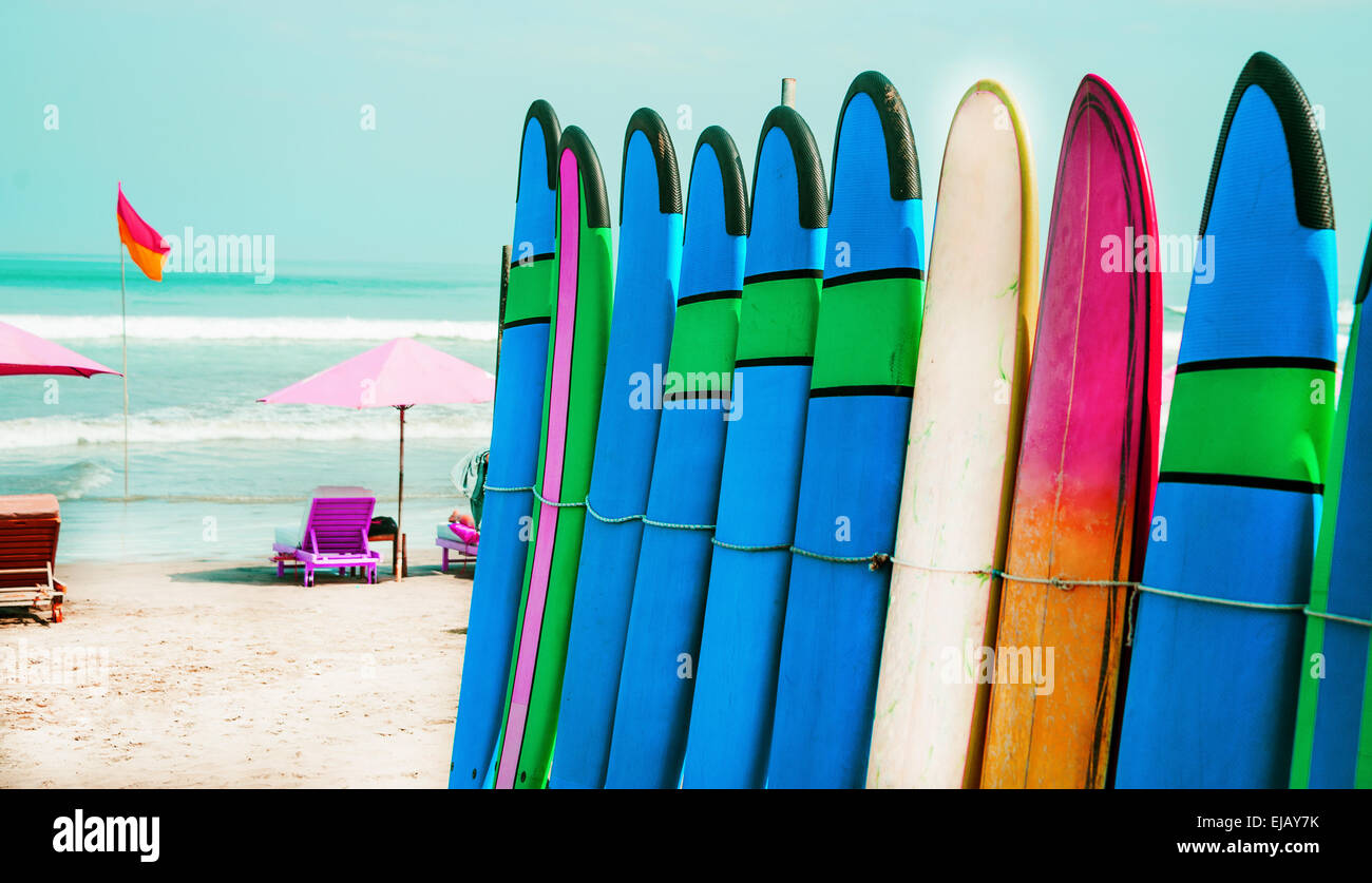 Color surf boards in a stack by ocean Stock Photo - Alamy