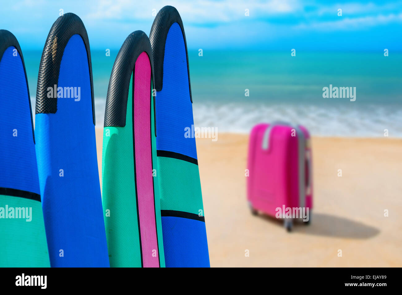 Color surf boards in a stack by ocean Stock Photo - Alamy