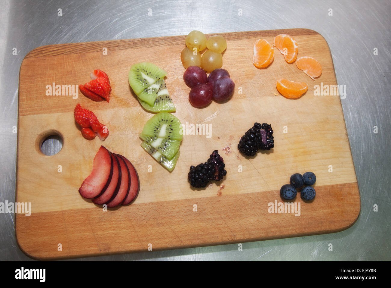 cutting fruits on board. sweet food Stock Photo - Alamy