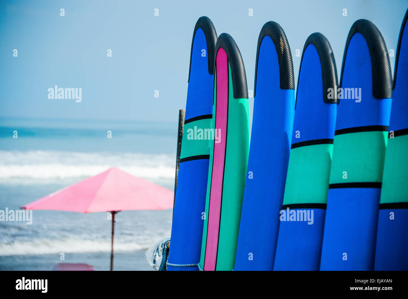 Color surf boards in a stack by ocean Stock Photo - Alamy