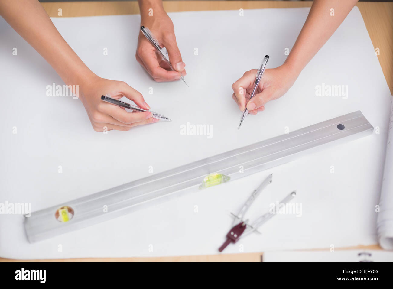 Architecture team working together at desk Stock Photo - Alamy