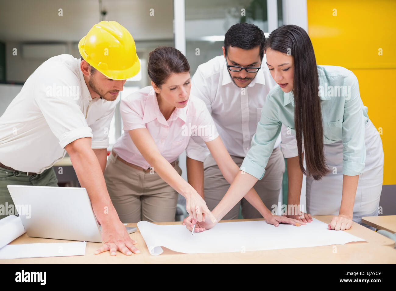 Architecture team working together at desk Stock Photo - Alamy