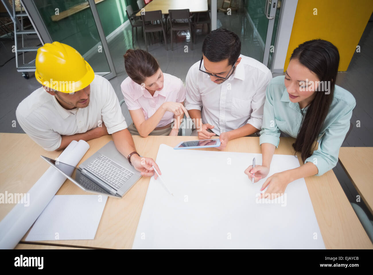 Architecture team working together at desk Stock Photo - Alamy