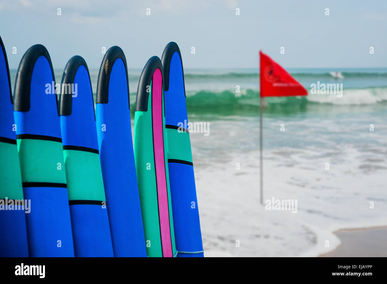 Color surf boards in a stack by ocean Stock Photo - Alamy