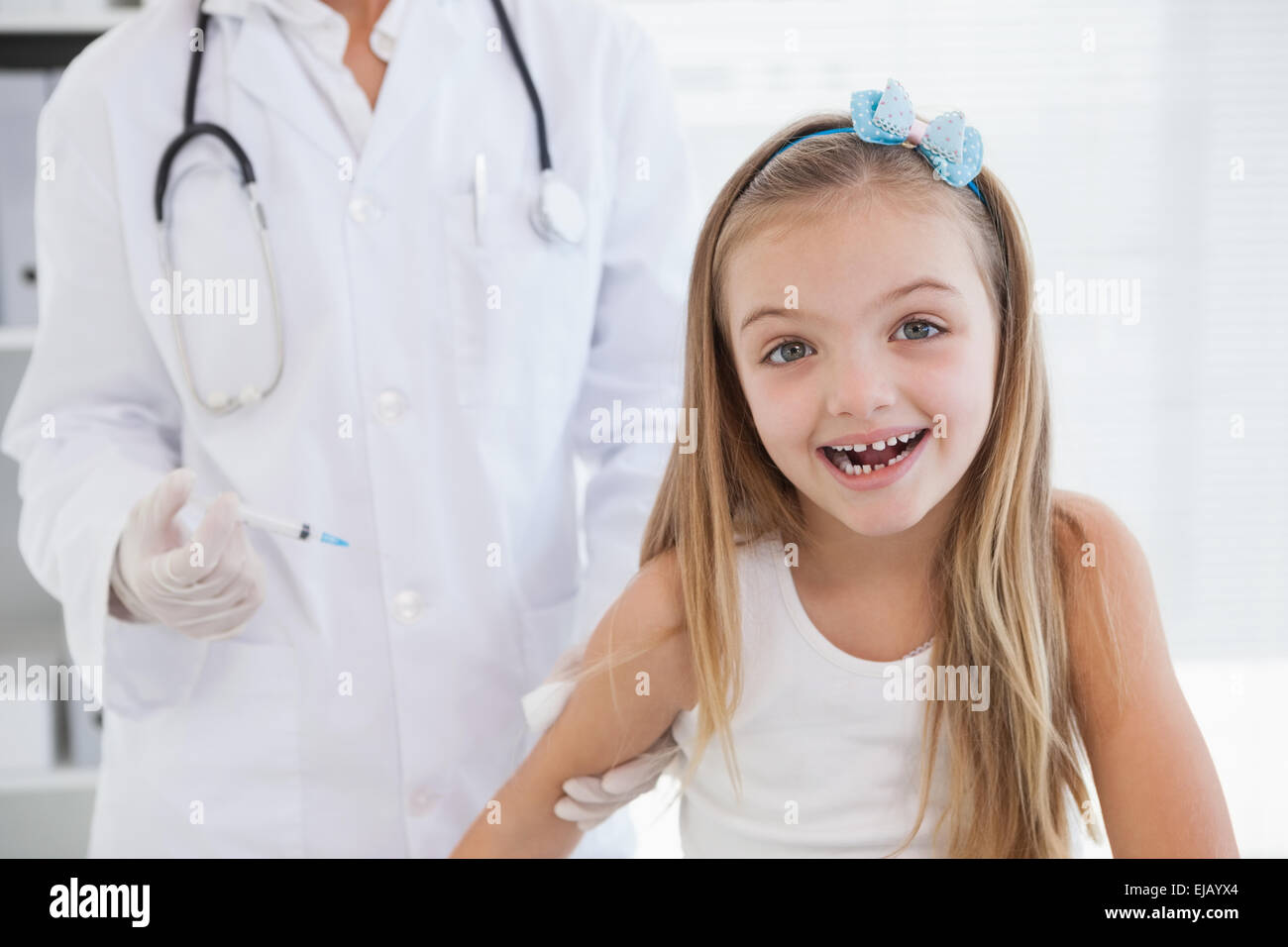 Smiling girl at the doctors Stock Photo - Alamy