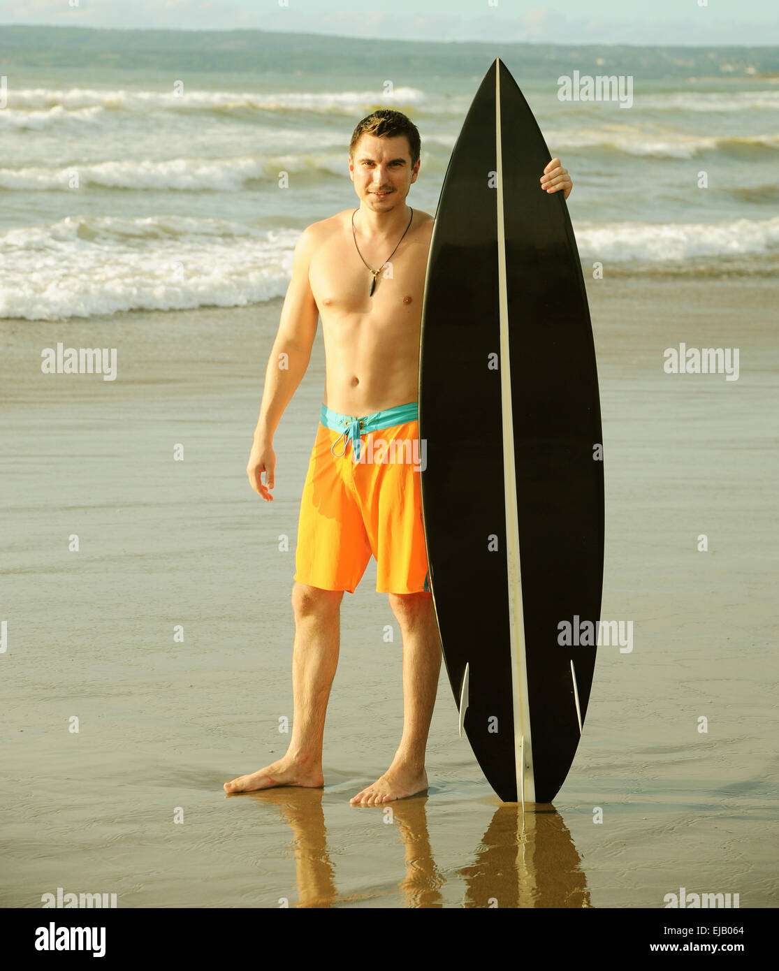 Surfer with board Stock Photo - Alamy