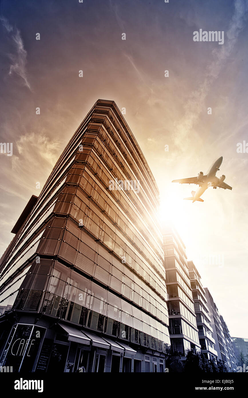 plane over office complex Stock Photo - Alamy