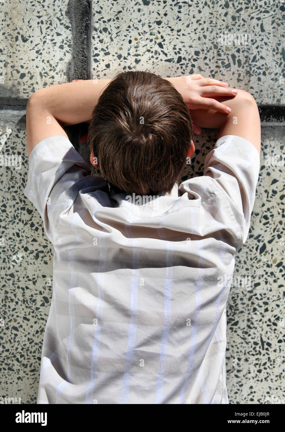 Kid by the Wall Stock Photo - Alamy