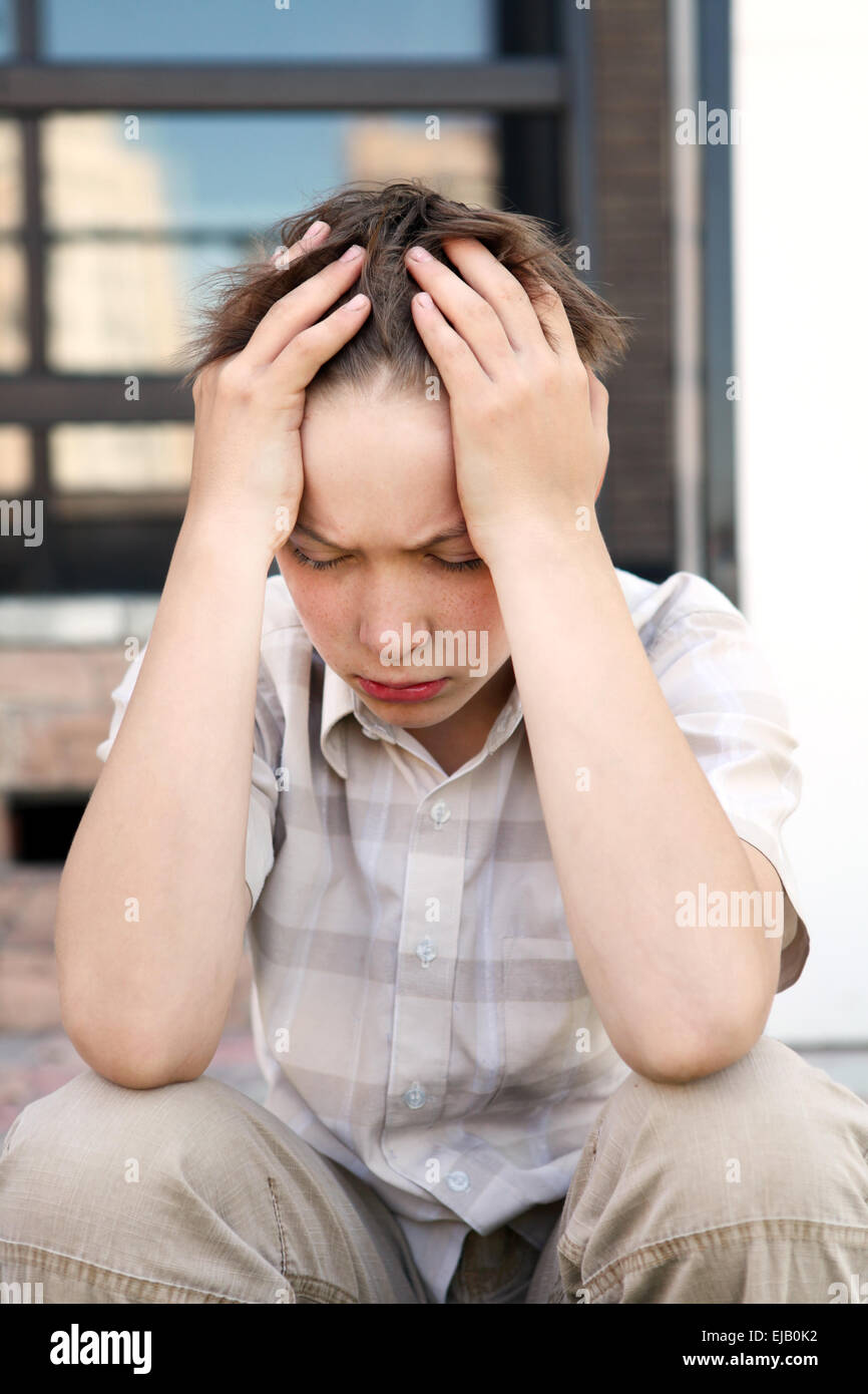 Sad Kid outdoor Stock Photo - Alamy