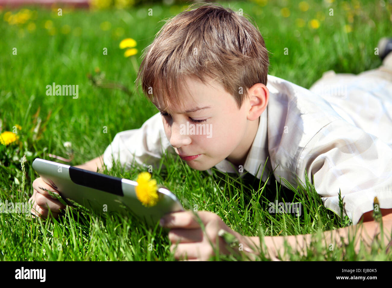 Kid with Tablet Computer Stock Photo - Alamy