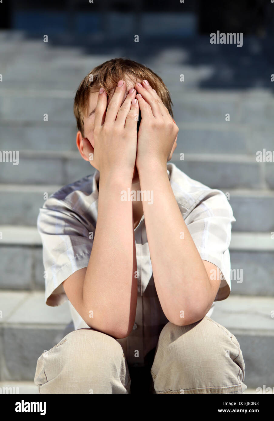 Sad Kid outdoor Stock Photo - Alamy