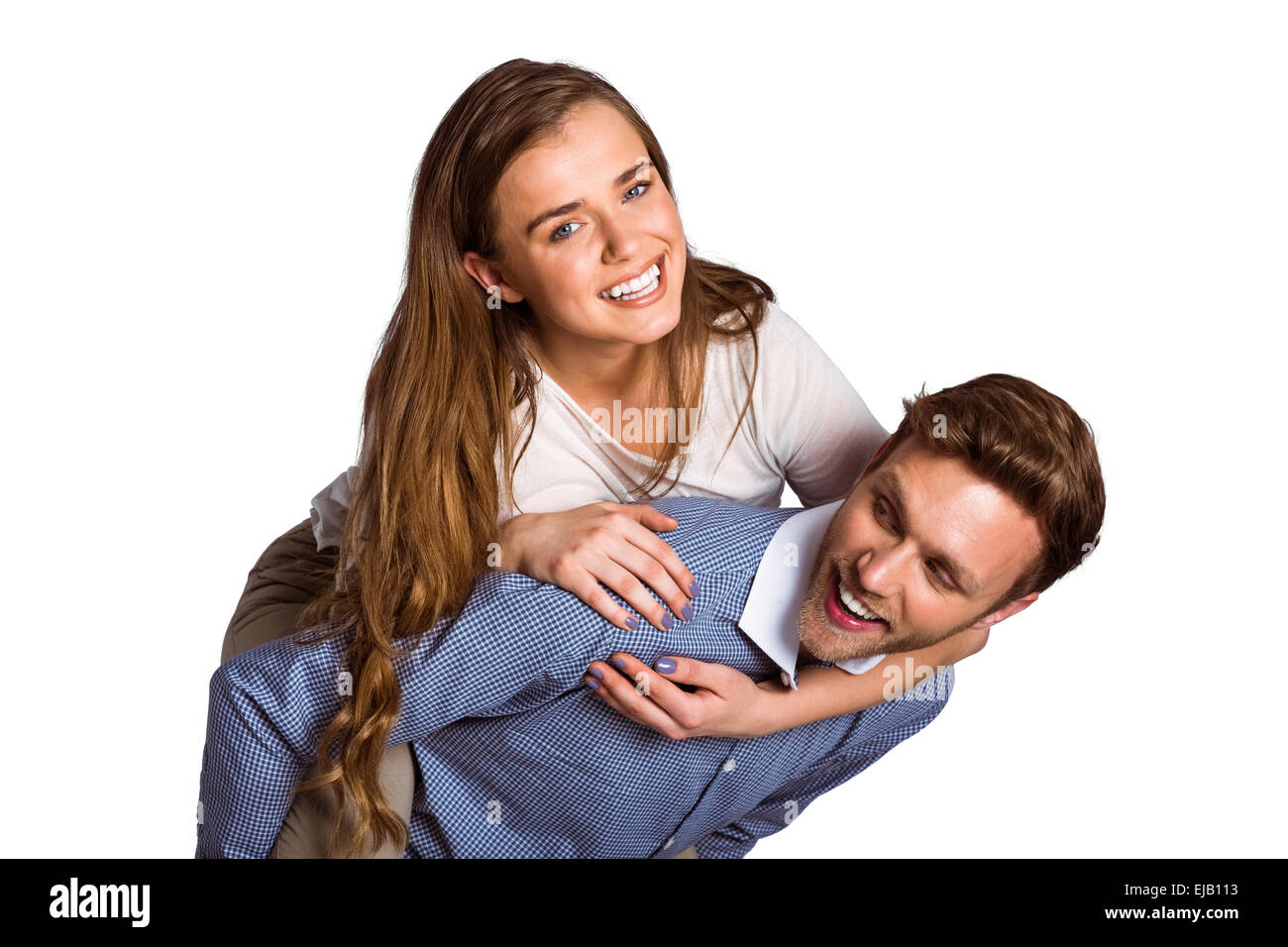 Smiling young man carrying woman Stock Photo - Alamy