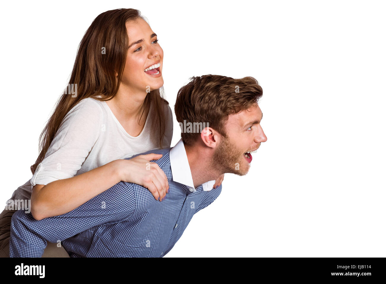 Smiling young man carrying woman Stock Photo - Alamy