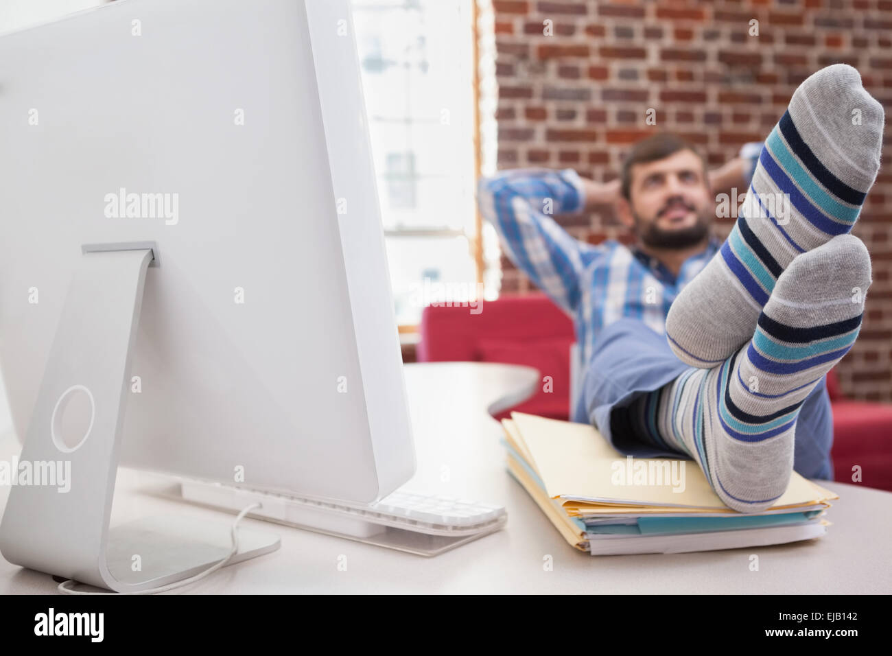 Feet up on desk hi-res stock photography and images - Alamy