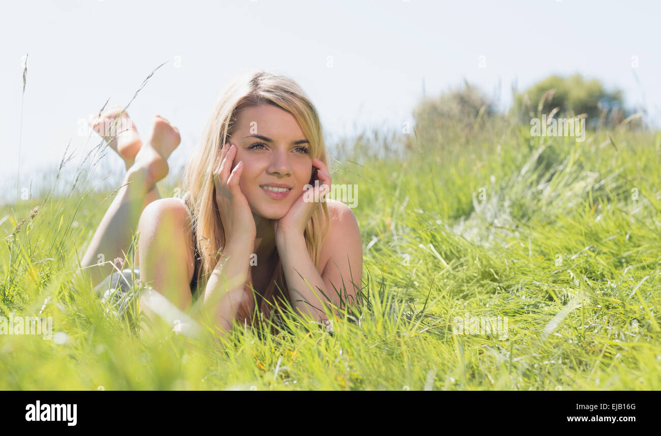 Woman dreaming lying on grass hi-res stock photography and images - Alamy