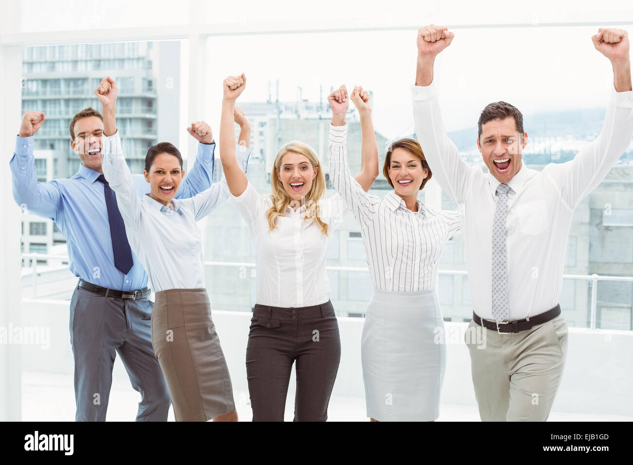 Business people cheering in office Stock Photo - Alamy