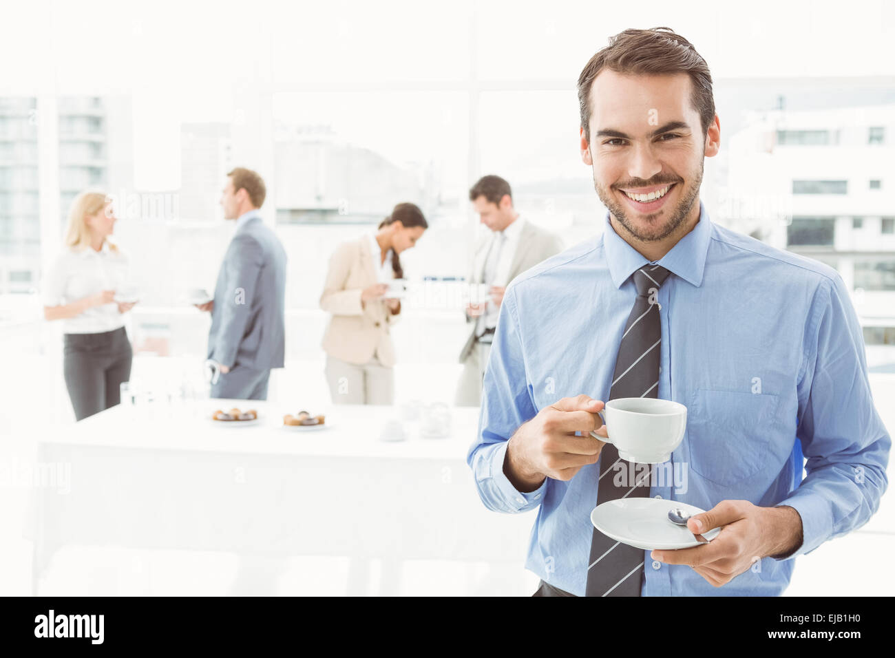 Work team during break time in office Stock Photo - Alamy