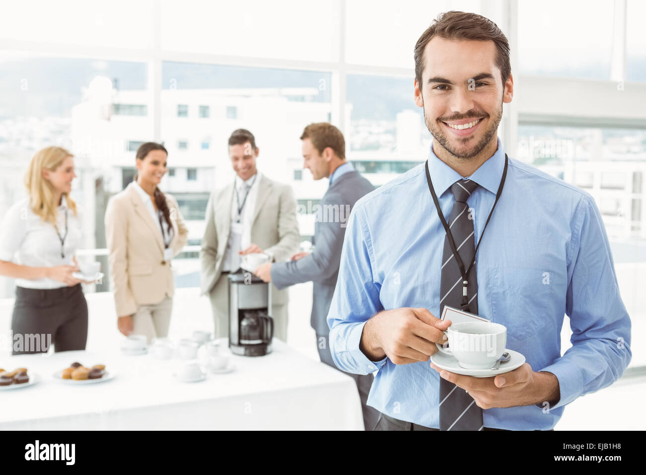 Work team during break time in office Stock Photo - Alamy
