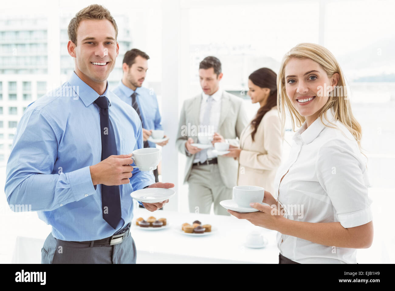 Work team during break time in office Stock Photo - Alamy