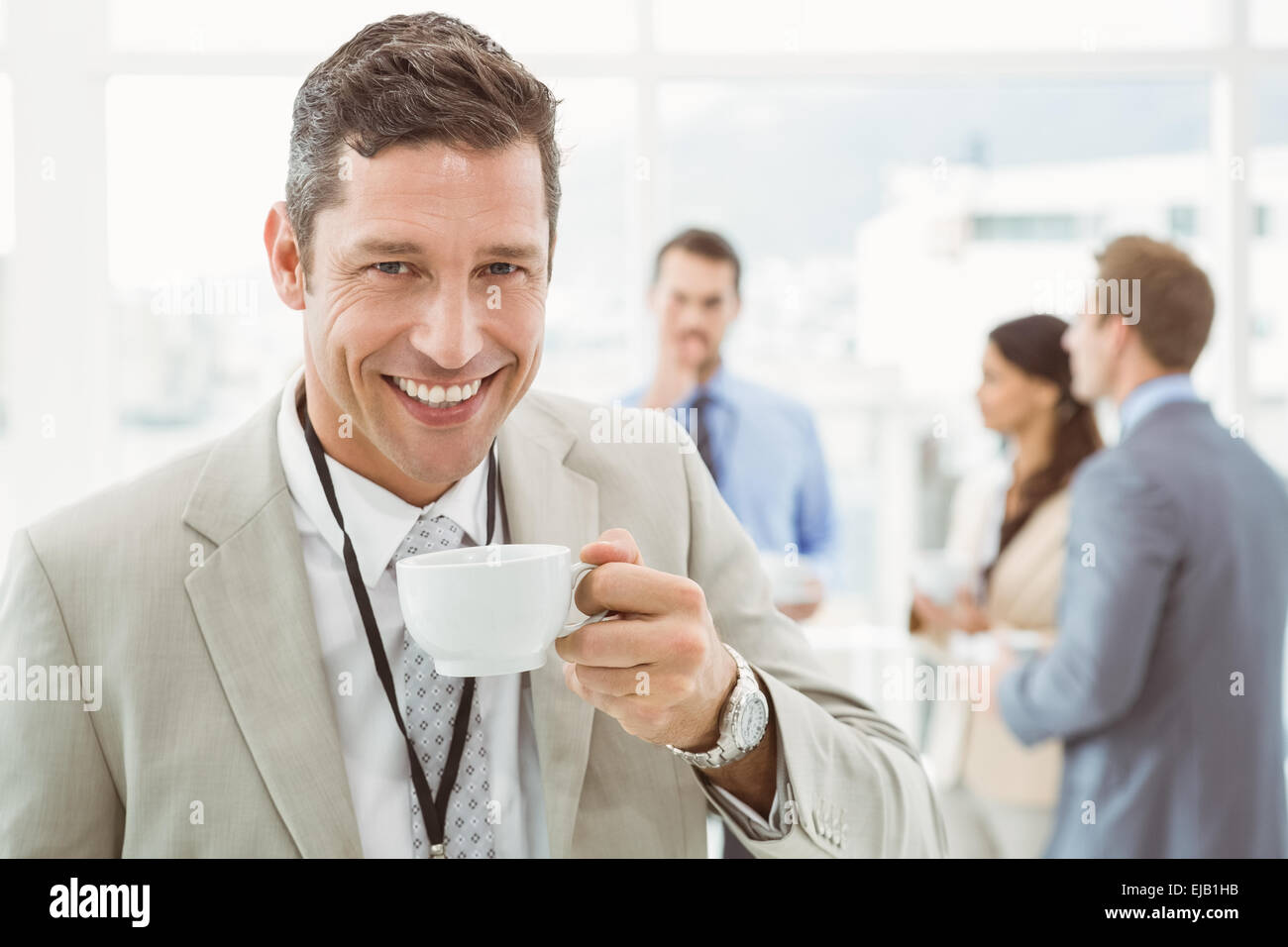 Work team during break time in office Stock Photo - Alamy