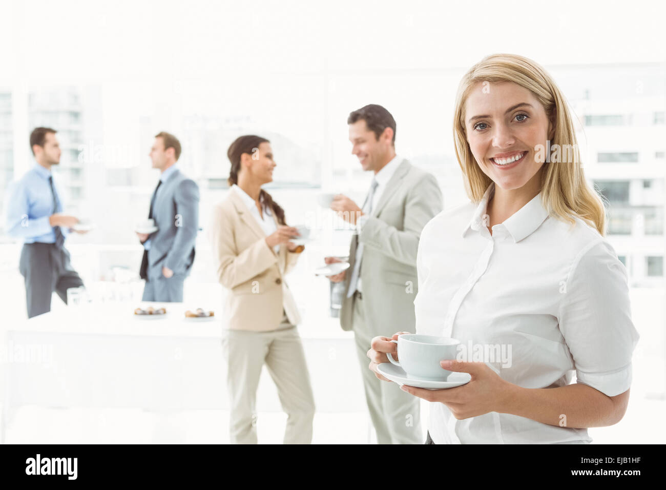 Work team during break time in office Stock Photo - Alamy