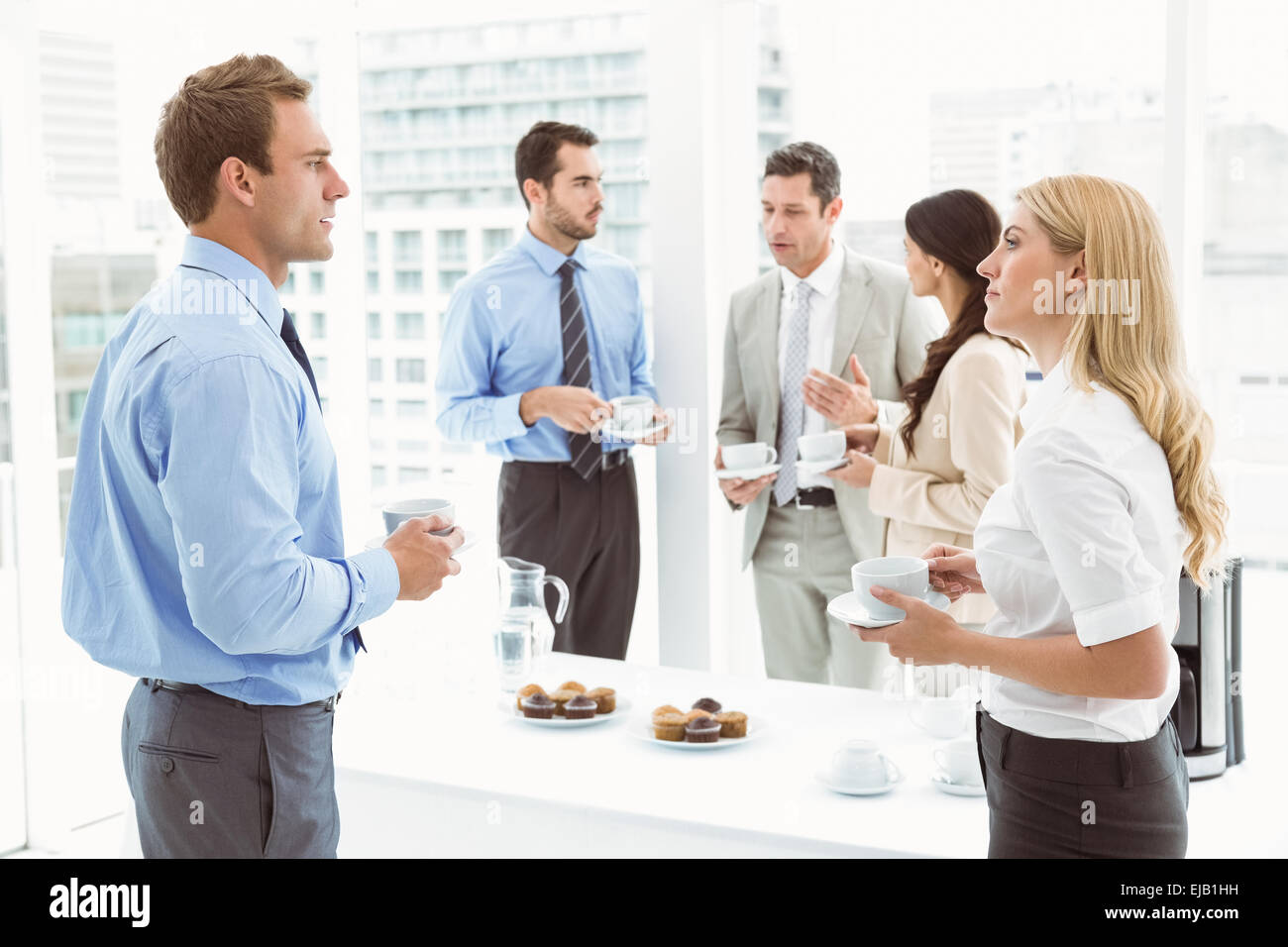 Work team during break time in office Stock Photo - Alamy