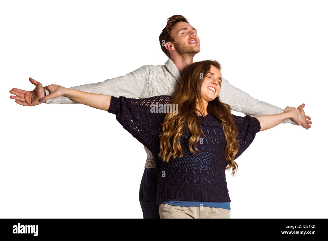 Romantic young couple with arms out Stock Photo - Alamy