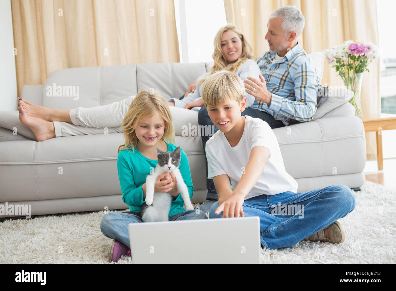 Happy family spending time together Stock Photo - Alamy