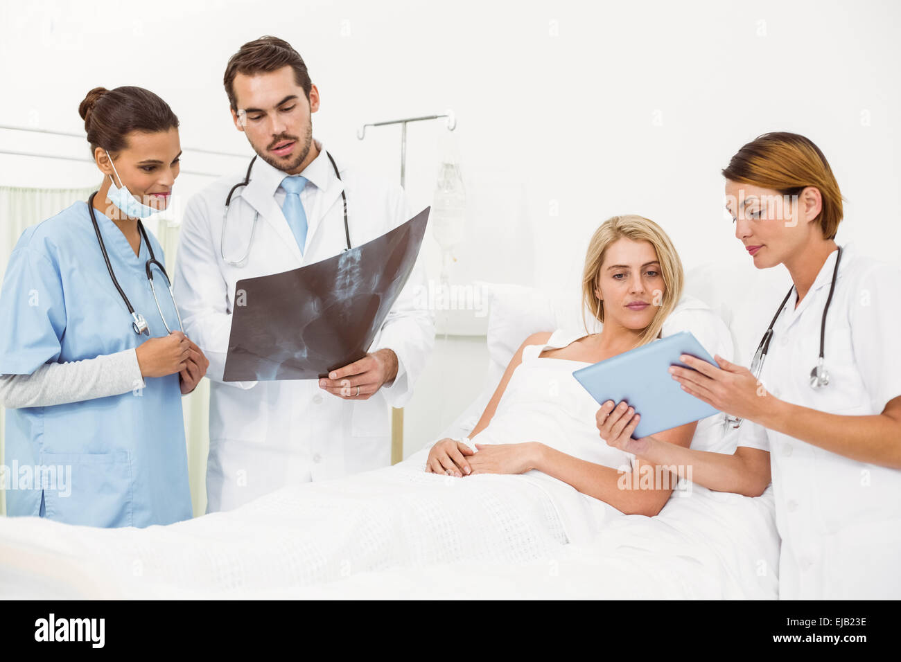 Portrait of doctors and patient with x-ray Stock Photo - Alamy