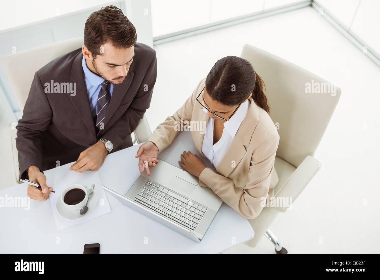 Business people using laptop in office Stock Photo - Alamy