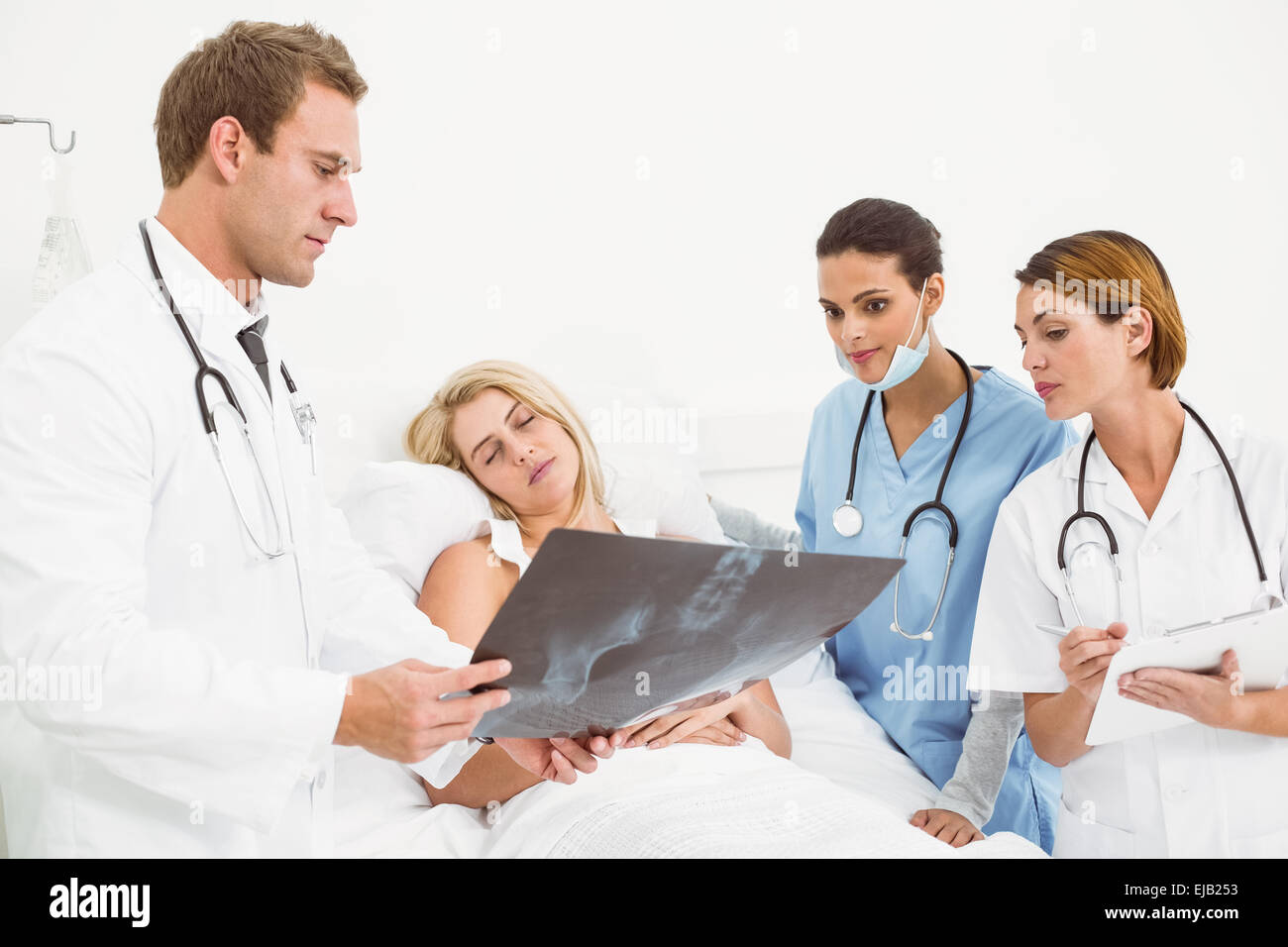 Doctors explaining x-ray to patient Stock Photo - Alamy