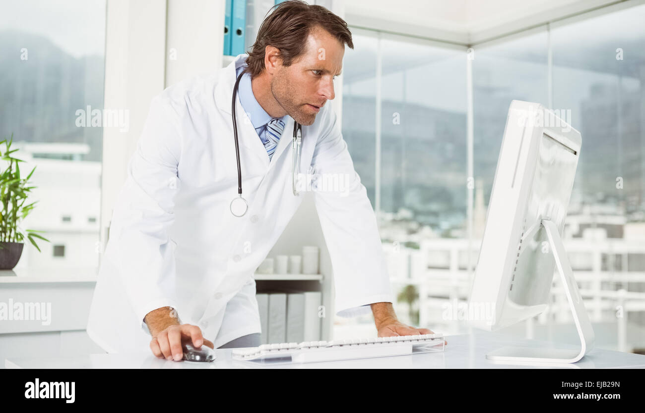 Doctor using computer at medical office Stock Photo - Alamy
