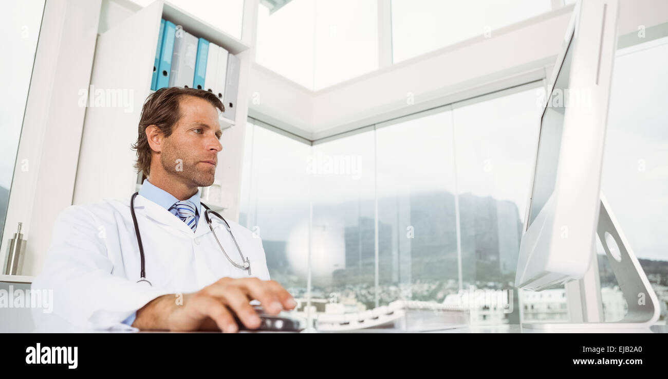 Doctor using computer at medical office Stock Photo - Alamy