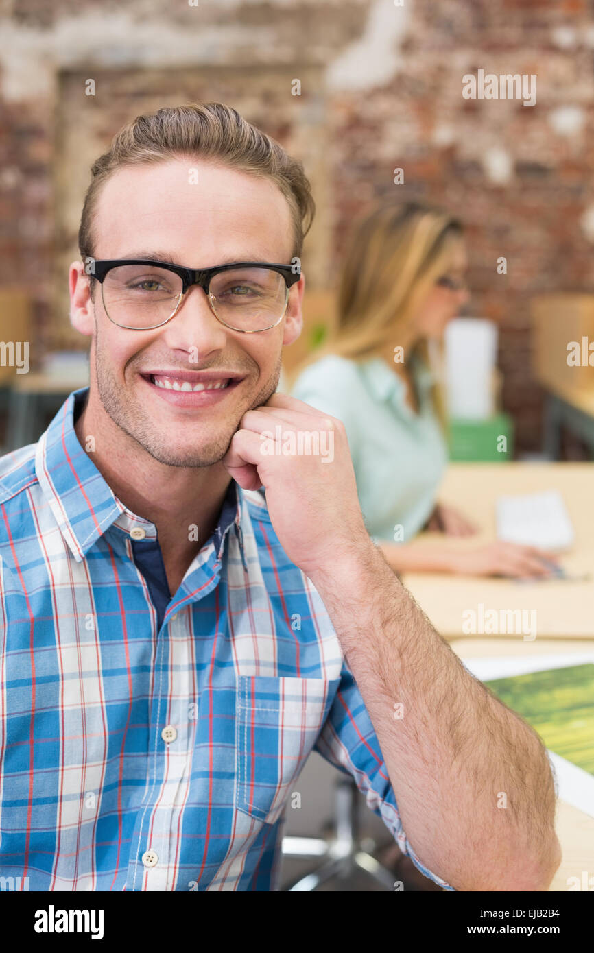 Smiling male photo editor in office Stock Photo - Alamy