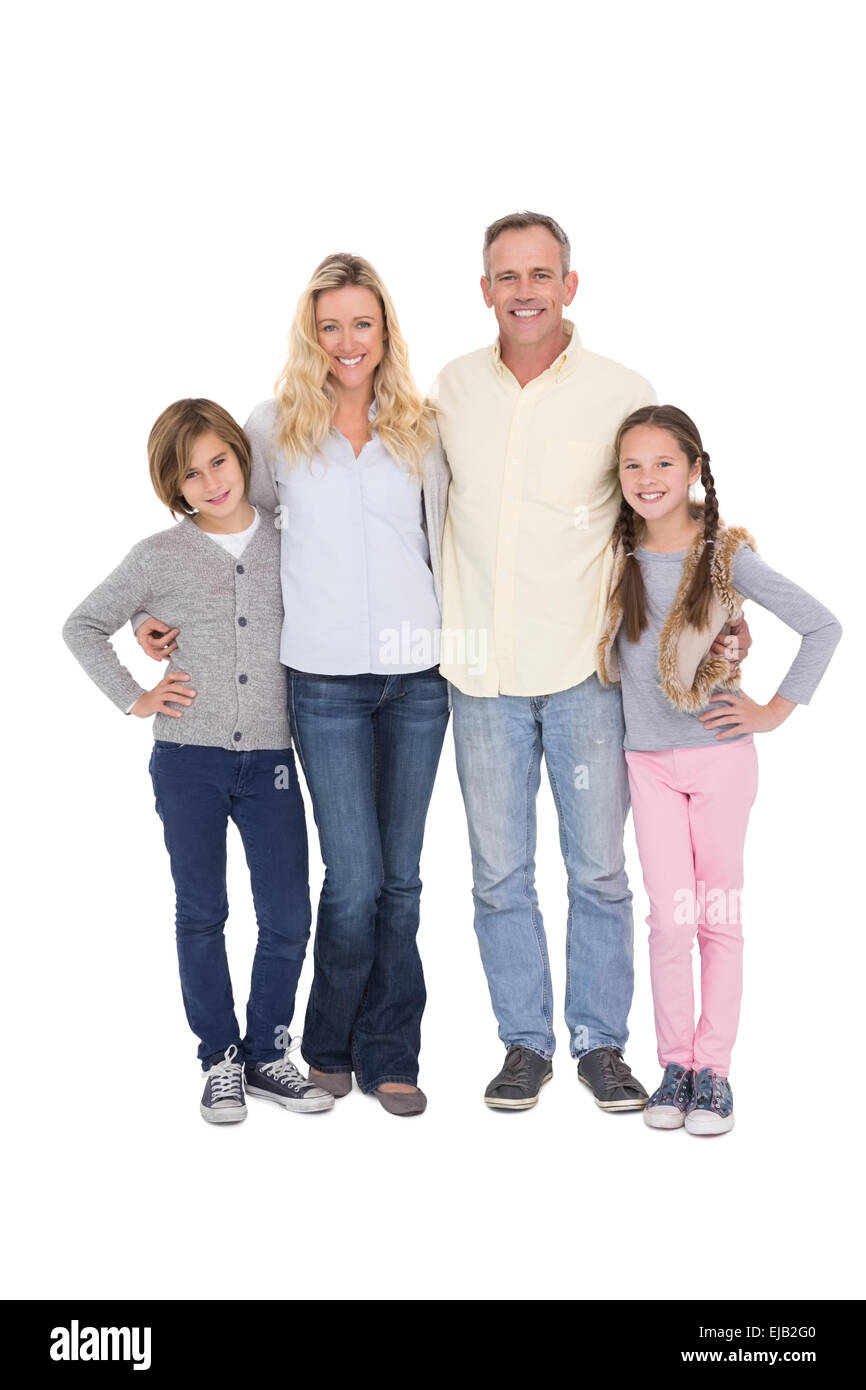 Portrait of smiling family standing together Stock Photo - Alamy